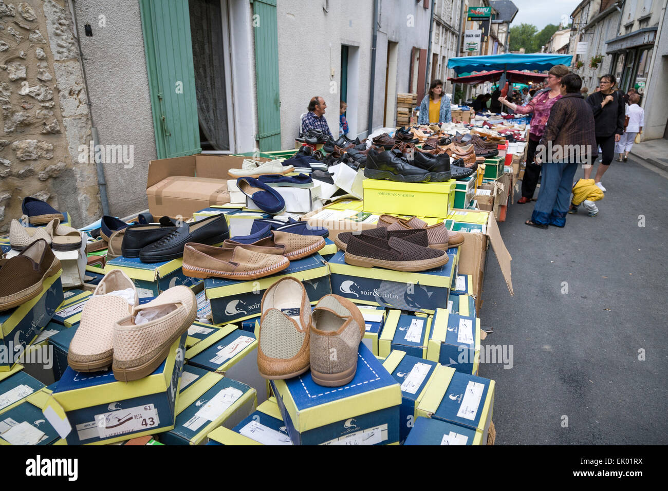 Shoes on display for sale on a market stall in Eymet, France Stock ...