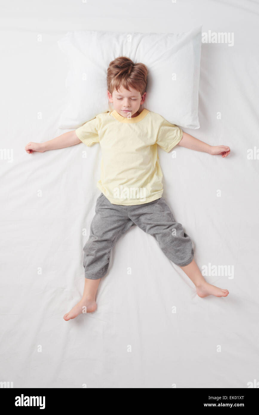 Top view of little boy sleeping in Star pose Stock Photo - Alamy