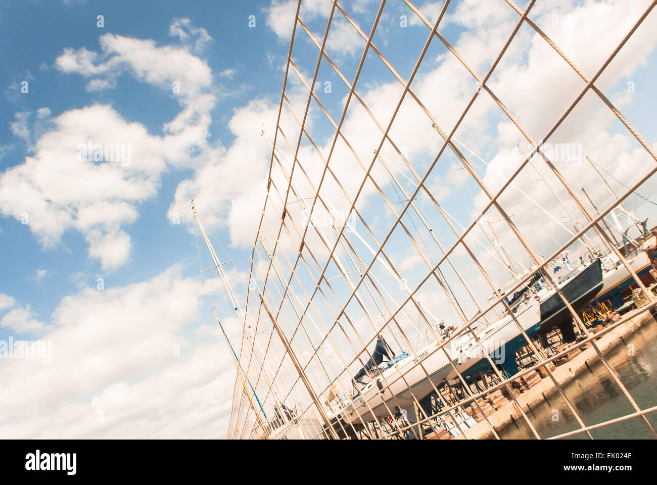 Yellow wire mesh in a marina Stock Photo - Alamy