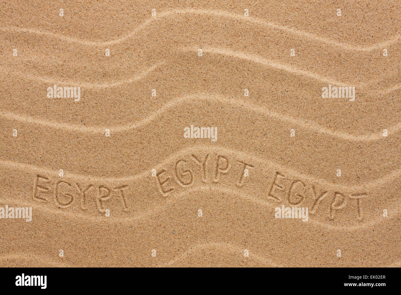 Egypt inscription on the wavy sand, as background Stock Photo - Alamy