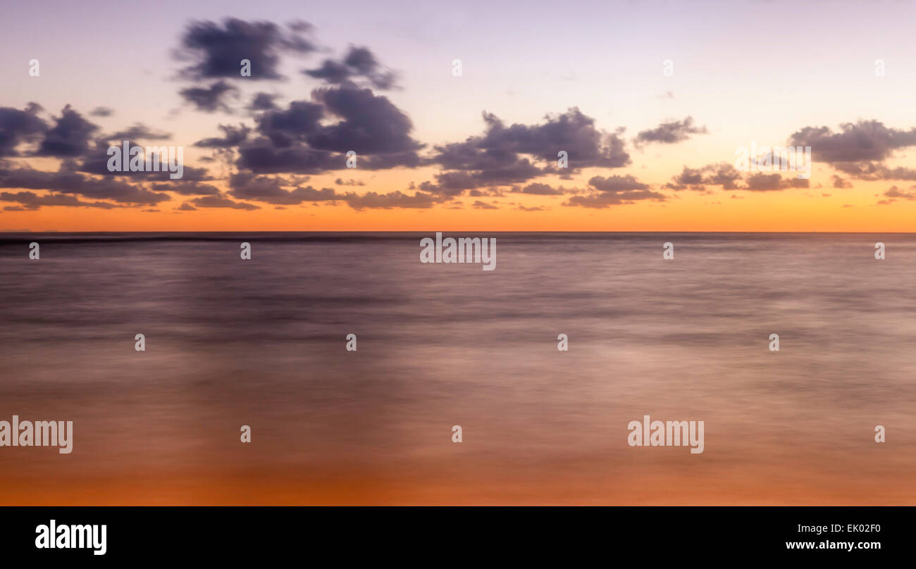 Vibrant Orange Sunset on Tropical Island Stock Photo - Alamy