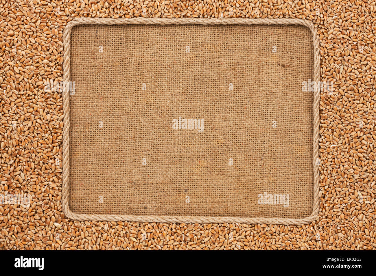 Frame made of rope with wheat grains on sackcloth, with place for your ...