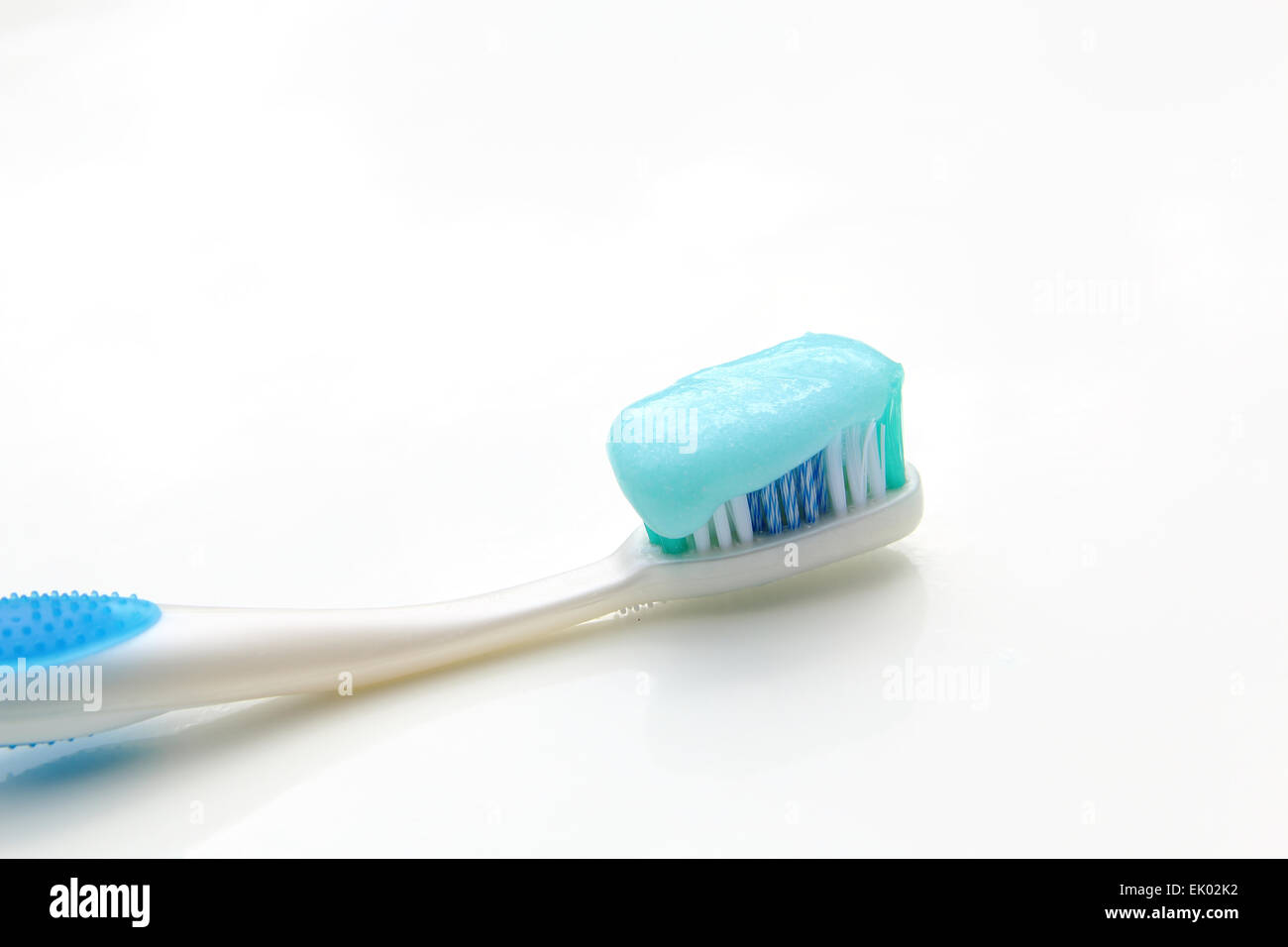 toothbrush on the table with toothpaste and white background Stock ...