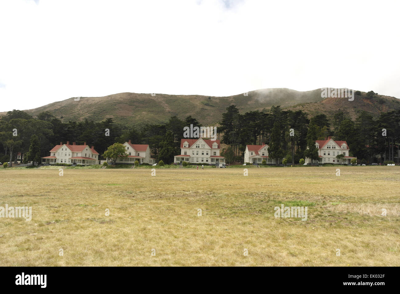 View across green grass Parade Ground towards 1903 Officers' Quarters ...