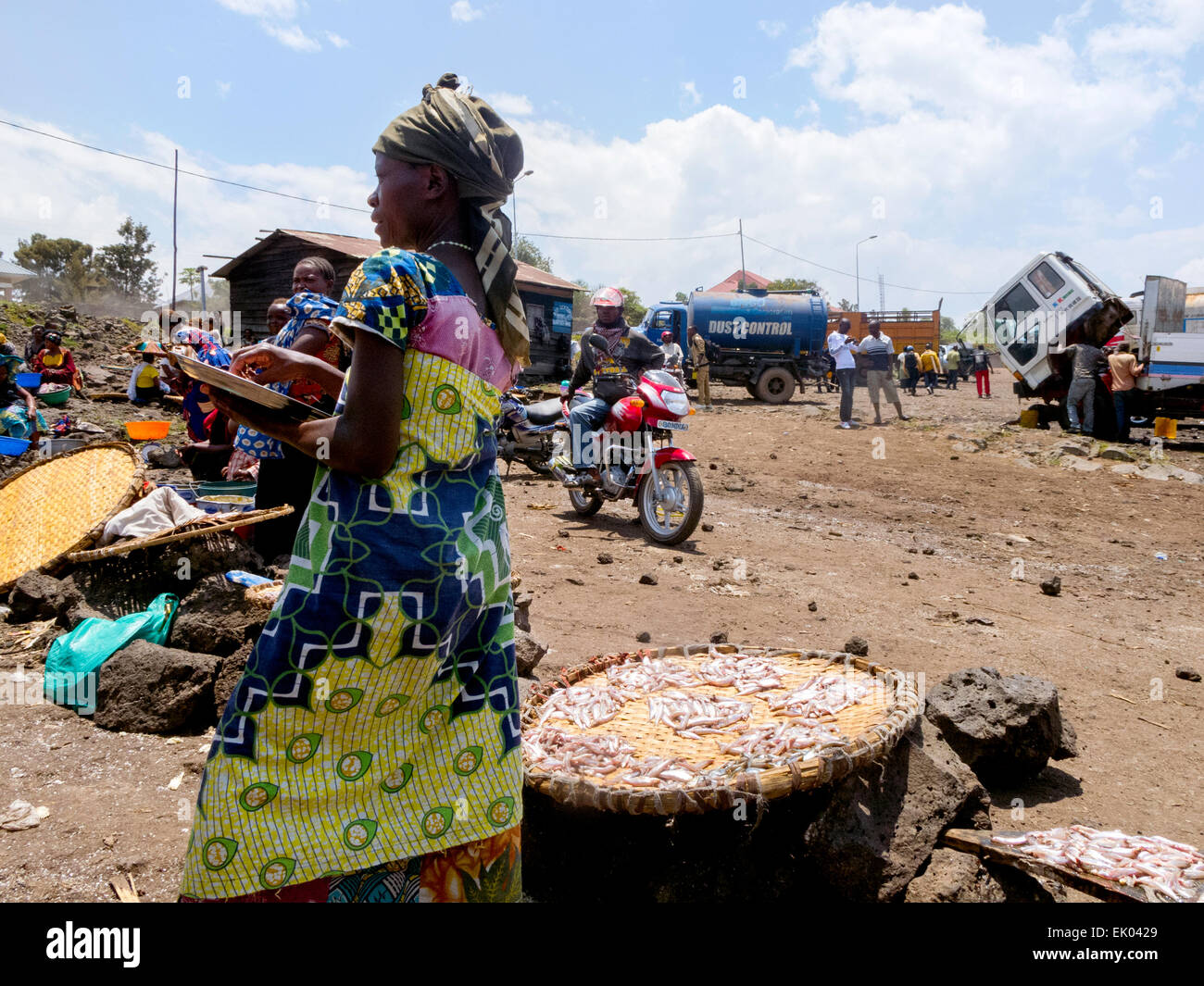 Congolese woman selling food at a fish market on the shores of Lake ...