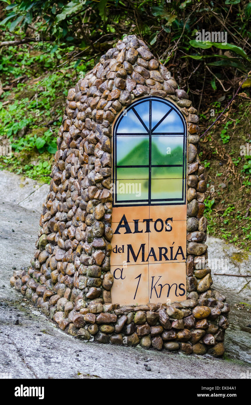 Colorfully decorated roadside mileage sign post. Panama, Central ...