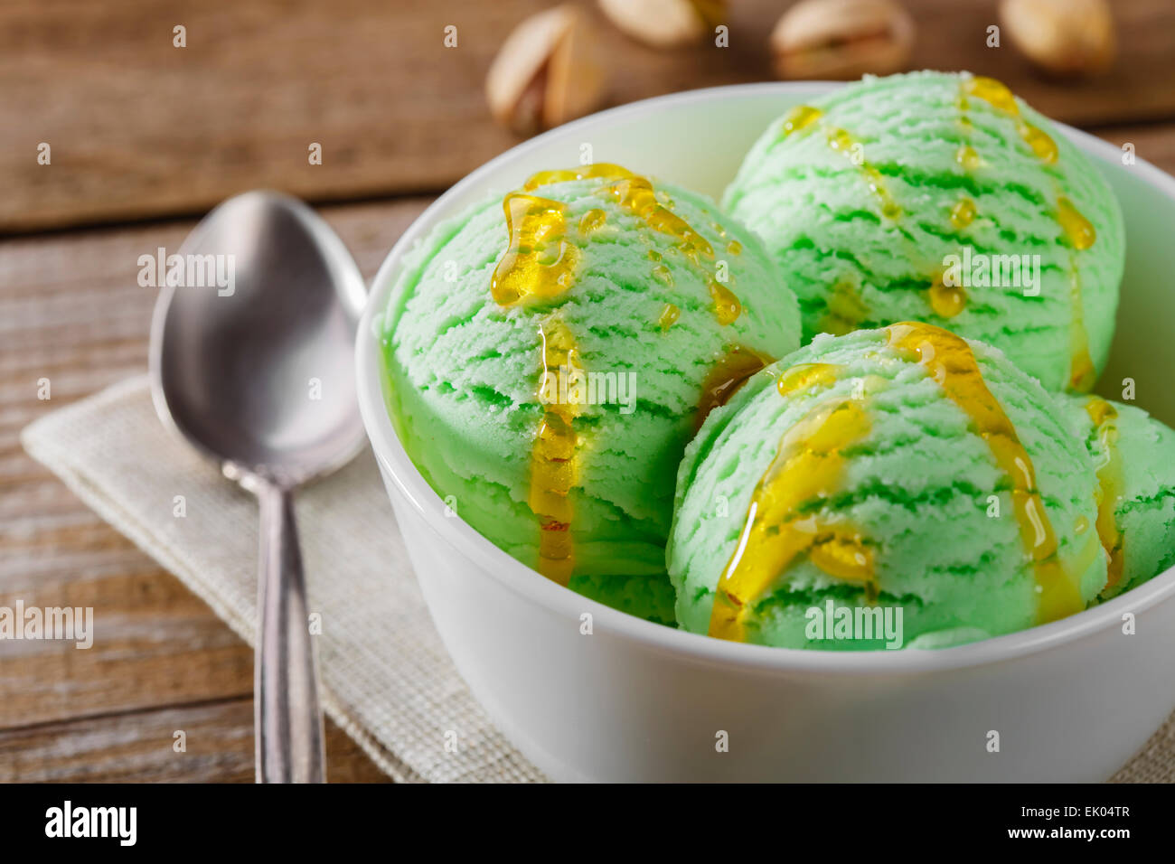 pistachio ice cream ball poured maple syrup Stock Photo - Alamy