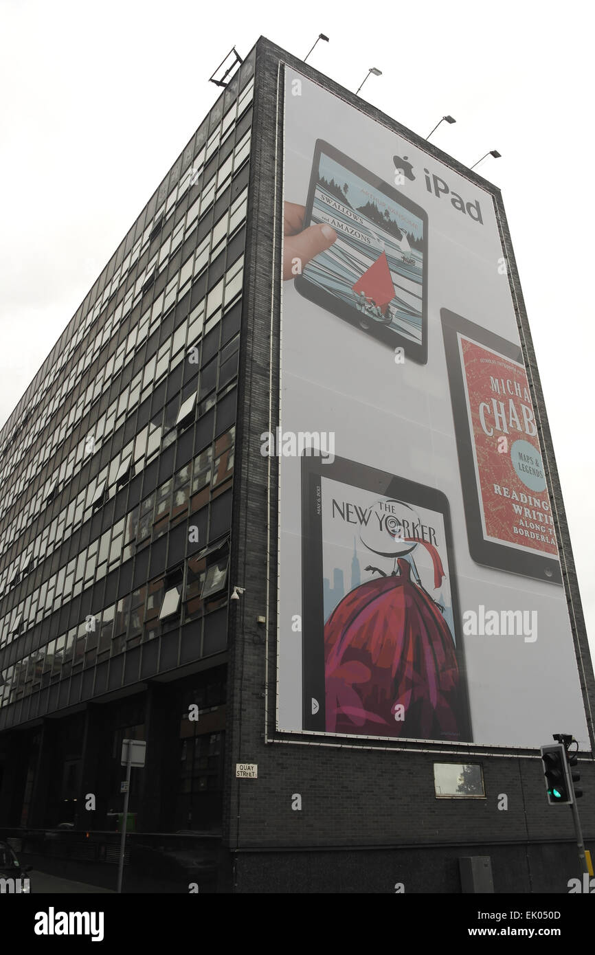 Grey sky portrait brick gable end HQ Building and Apple IPad billboards ...