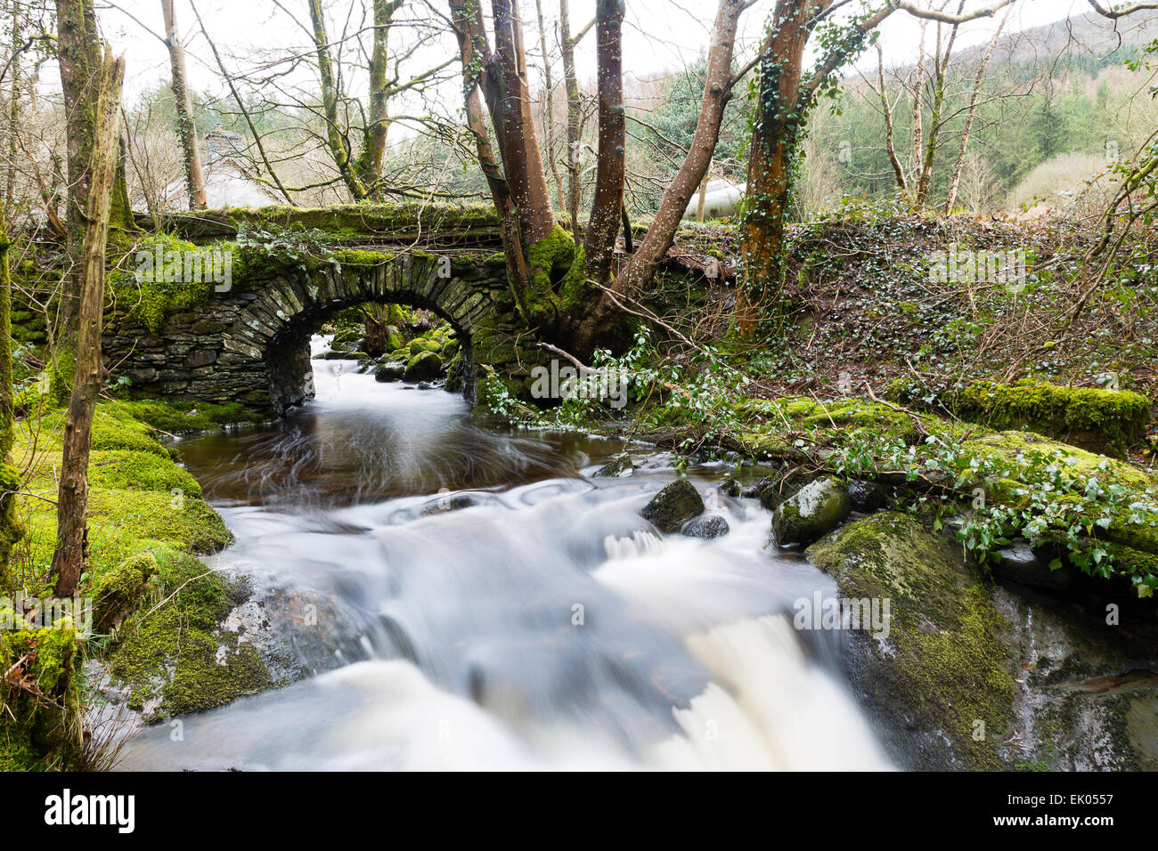 Hafod, Wales, UK. 3rd April, 2015. Waterfall running beneath old arched ...