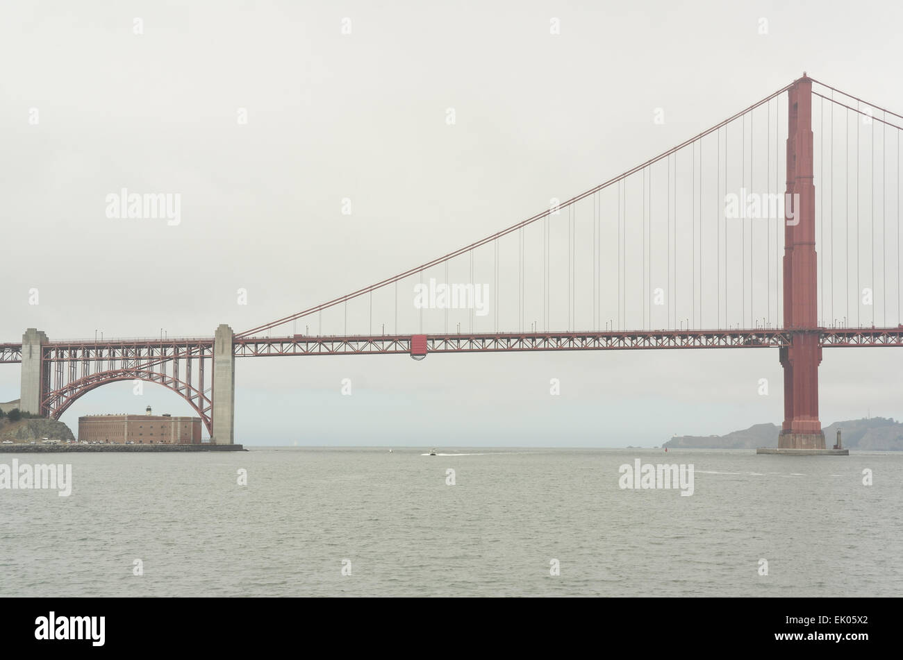 Grey sky view, from bay ferry, to Golden Gate Bridge South Tower and ...