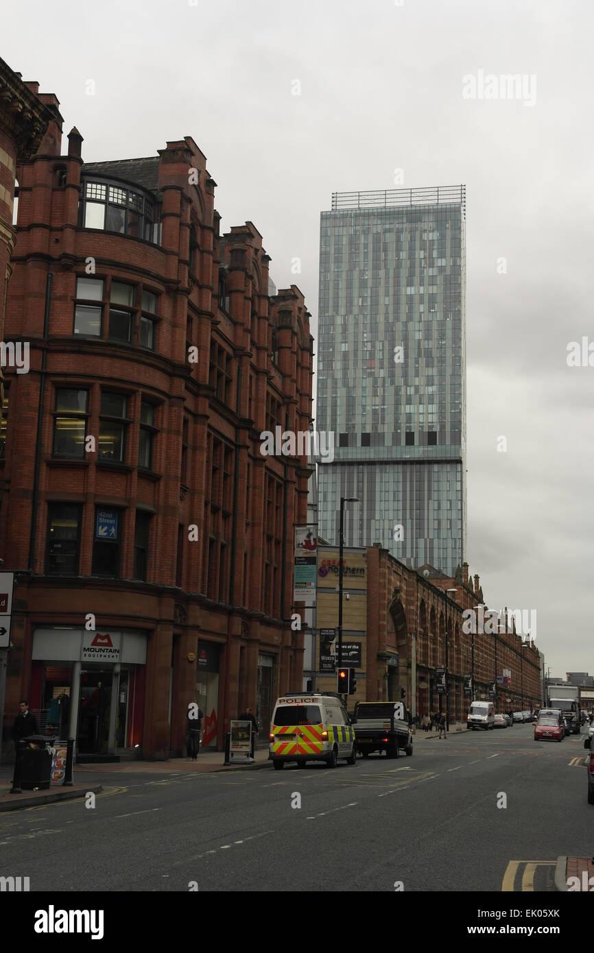 Grey sky portrait police dogs van and cars, Deansgate looking south to ...