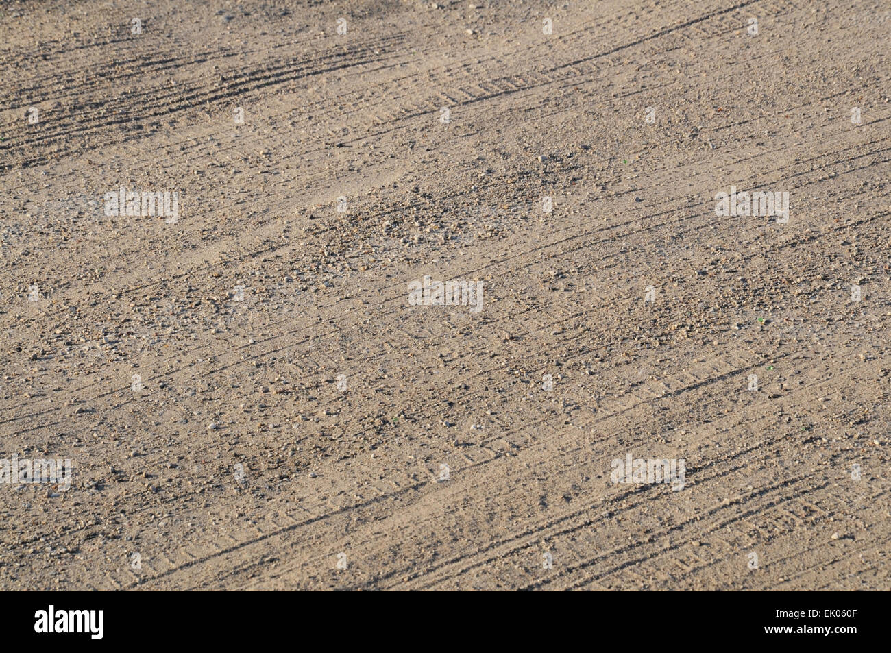 Partially covered with sand asphalt road. Close-up Stock Photo - Alamy