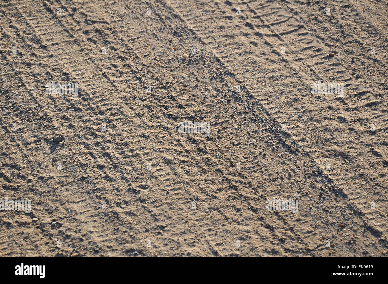 Partially covered with sand asphalt road. Close-up Stock Photo - Alamy