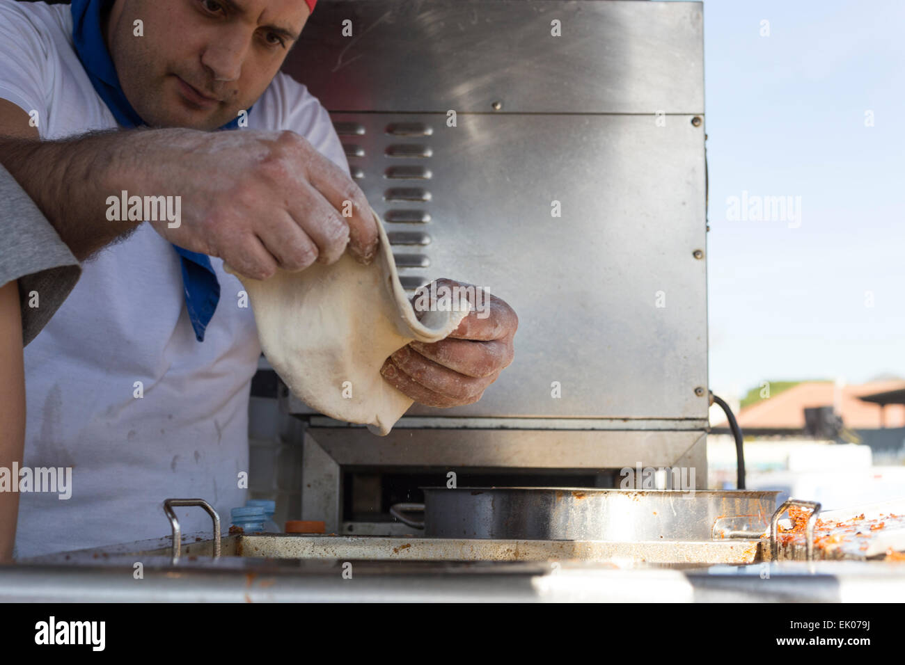 Street food in Italy: fried pizza maker Stock Photo - Alamy