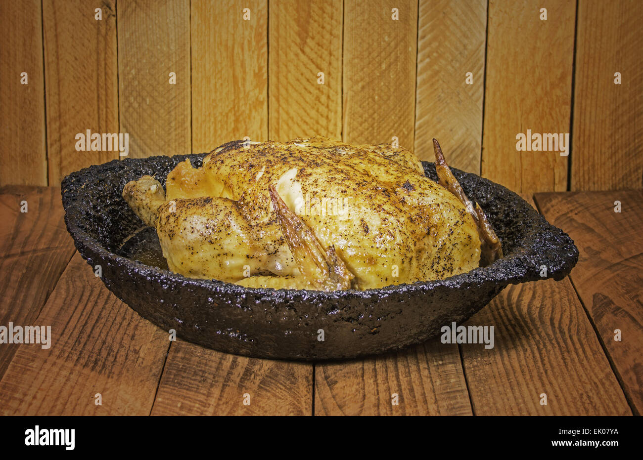 fried chicken in oil on an old frying pan Stock Photo - Alamy