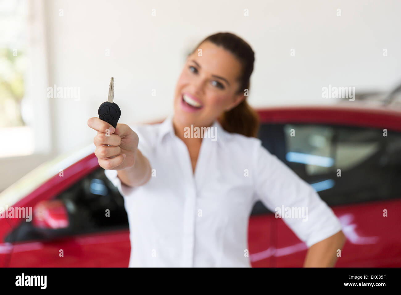 Woman picking up key hi-res stock photography and images - Alamy