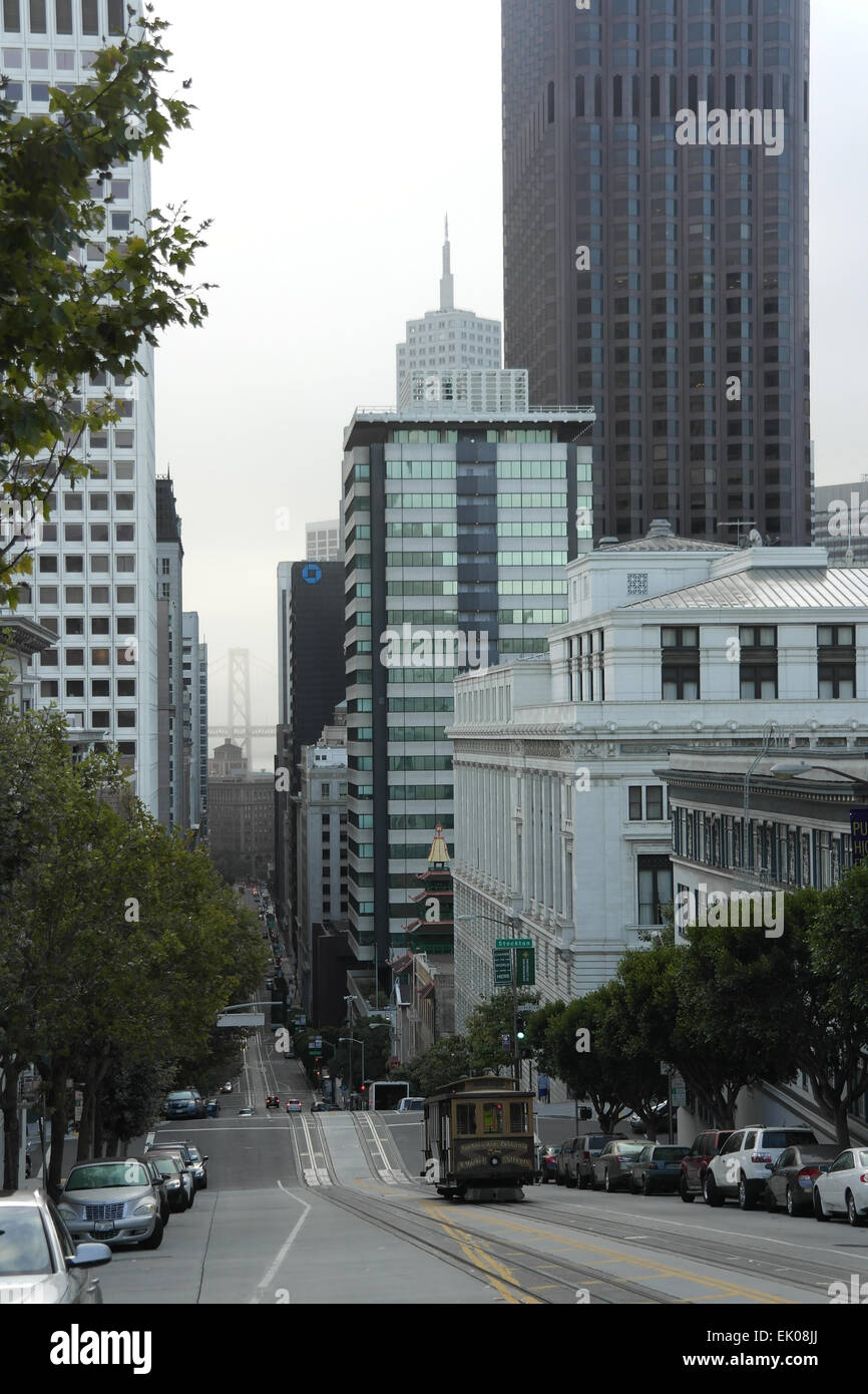Grey sky portrait cable car descending steep incline California Street ...