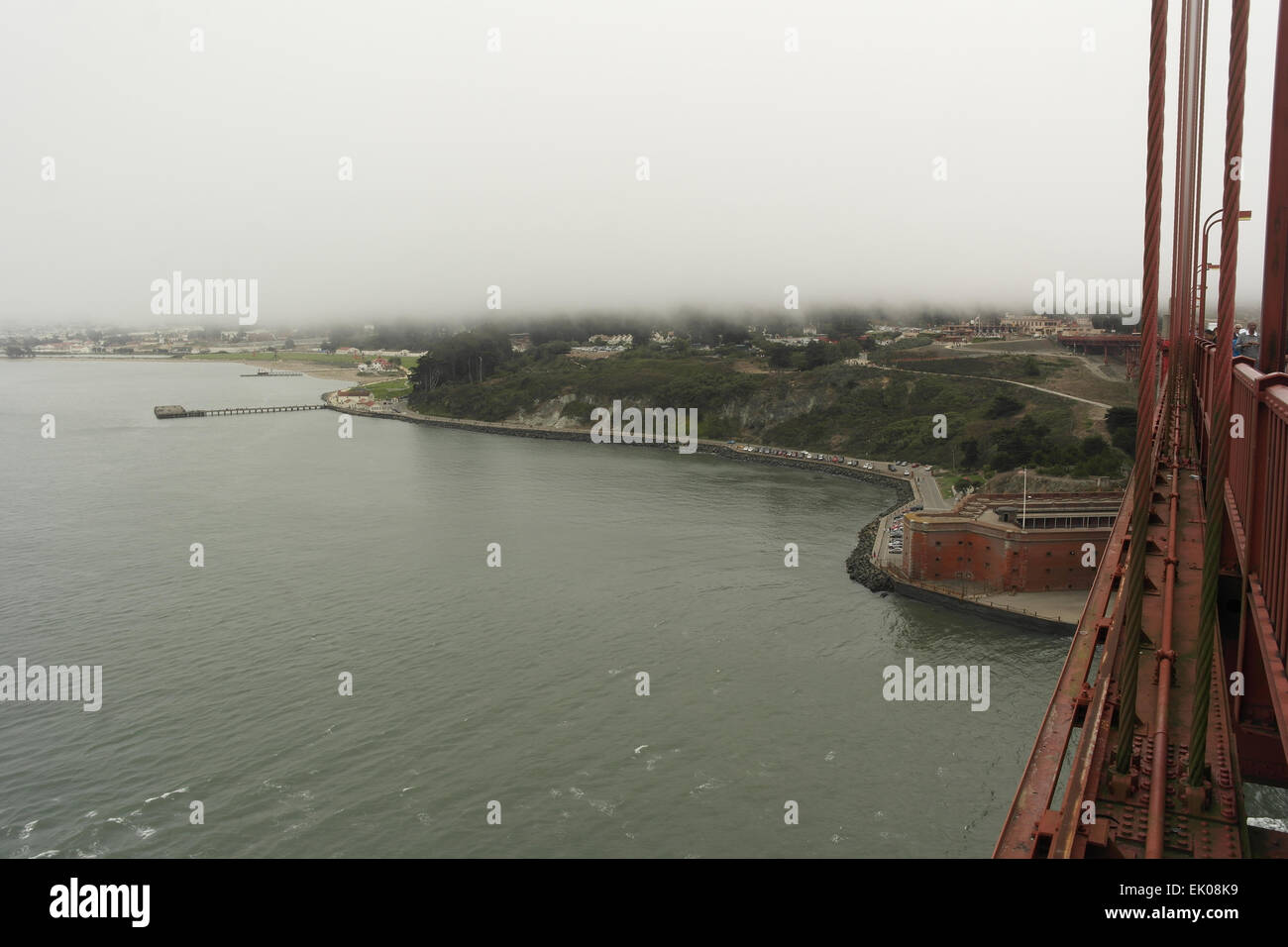 View from Golden Gate Bridge roadway suspender ropes towards Fort Point ...