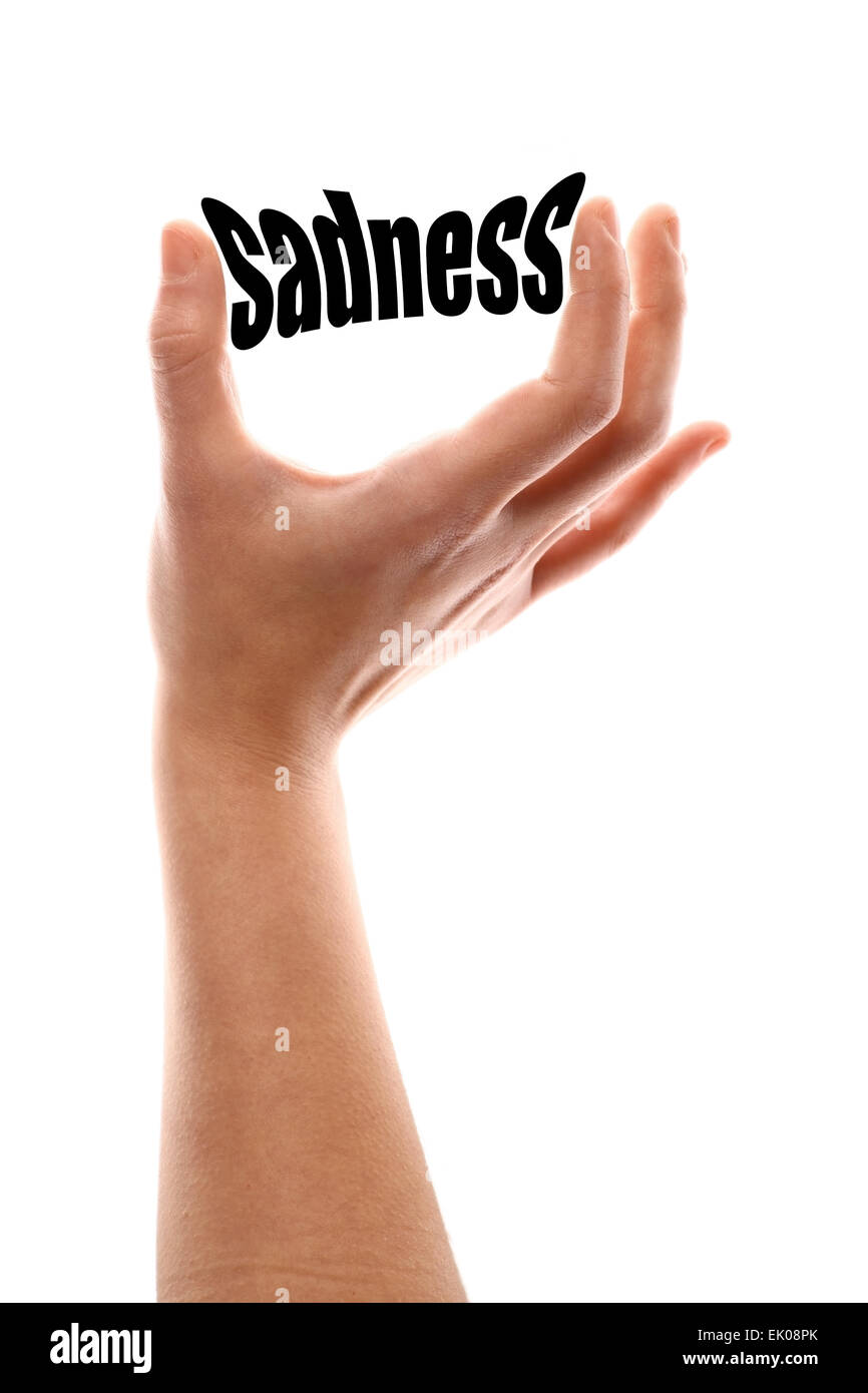 Color vertical shot of a of a hand squeezing the word "sadness Stock ...