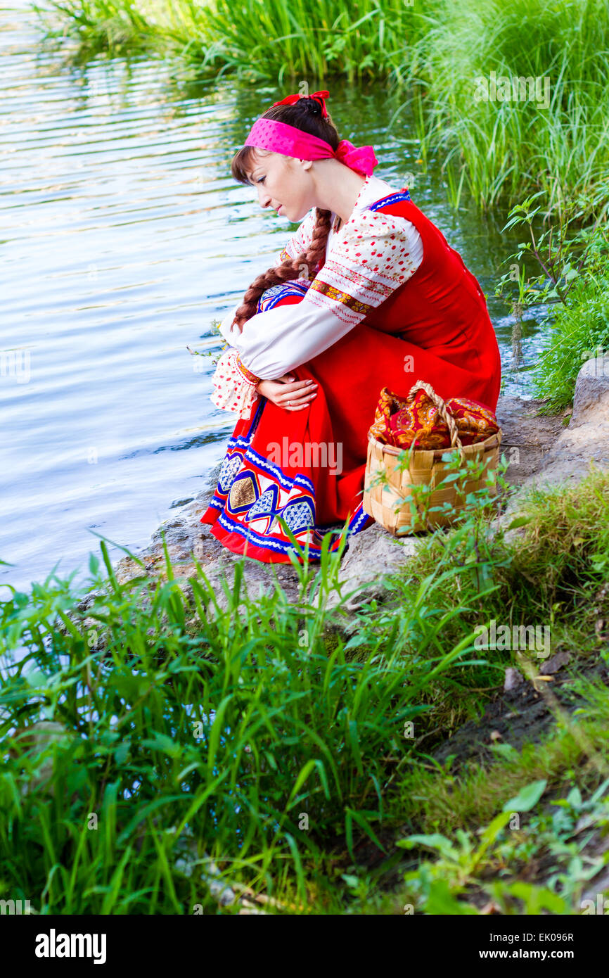 Young brunette woman near the river Stock Photo - Alamy