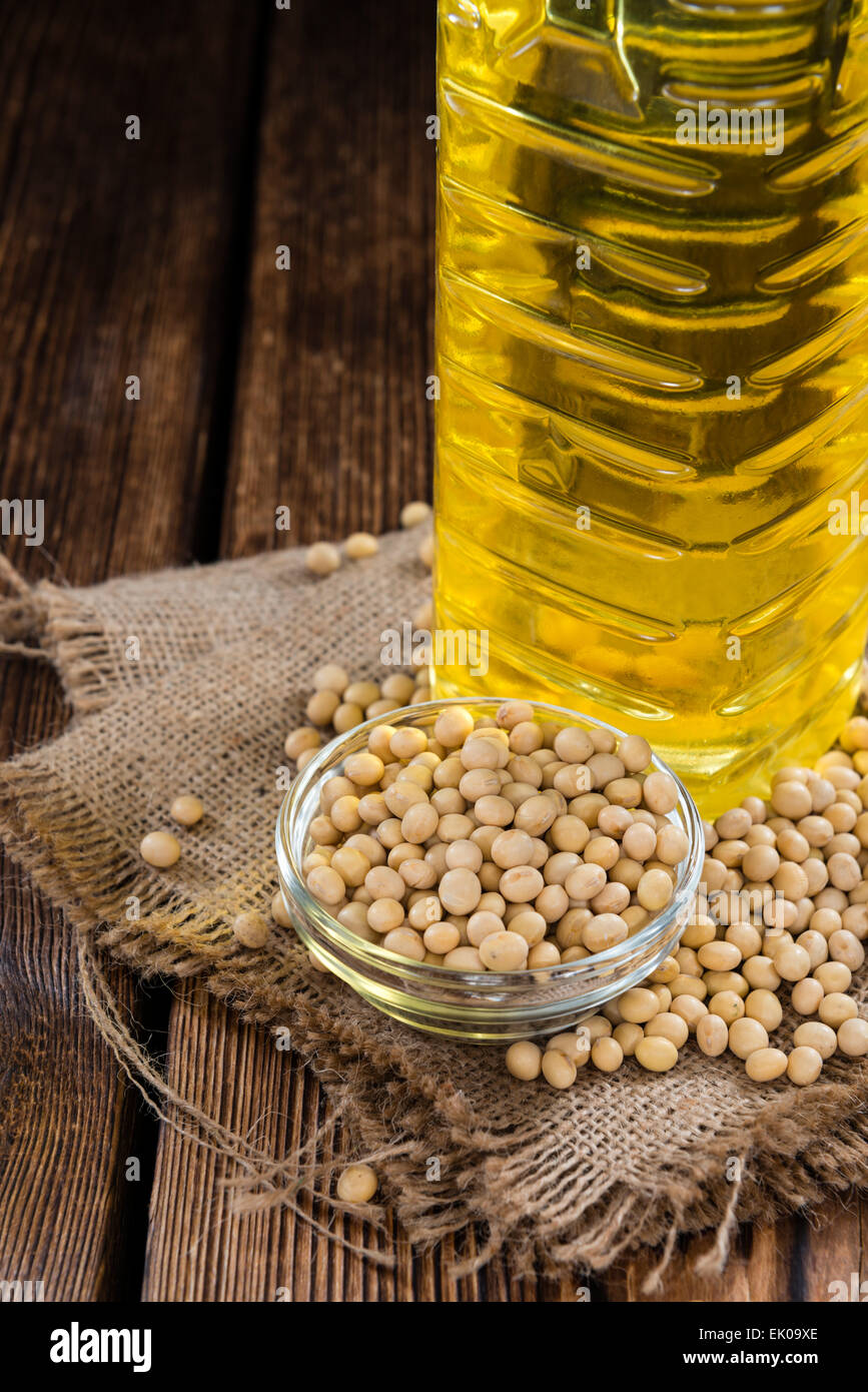 Golden Soy Oil on dark wooden background (close-up shot Stock Photo - Alamy