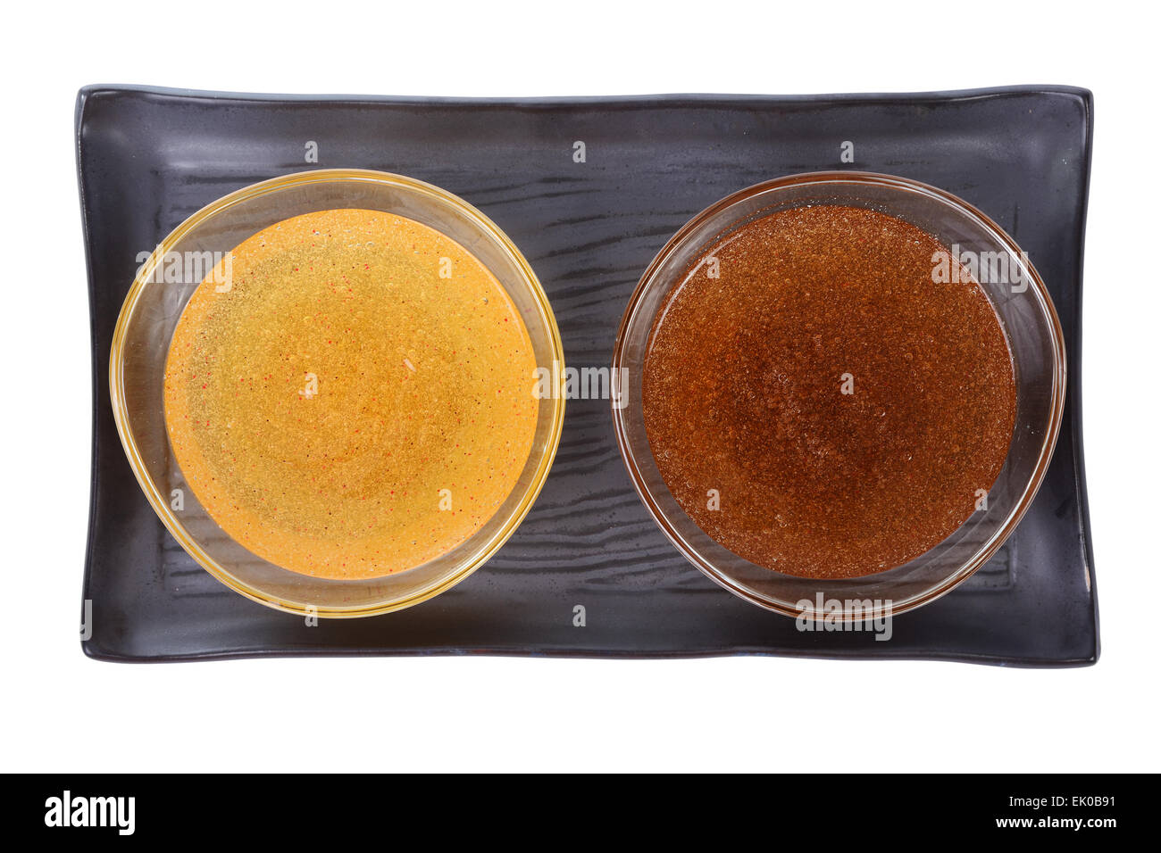 Two different of scrub oil, honey and sugar cane, for skin treatment on ...