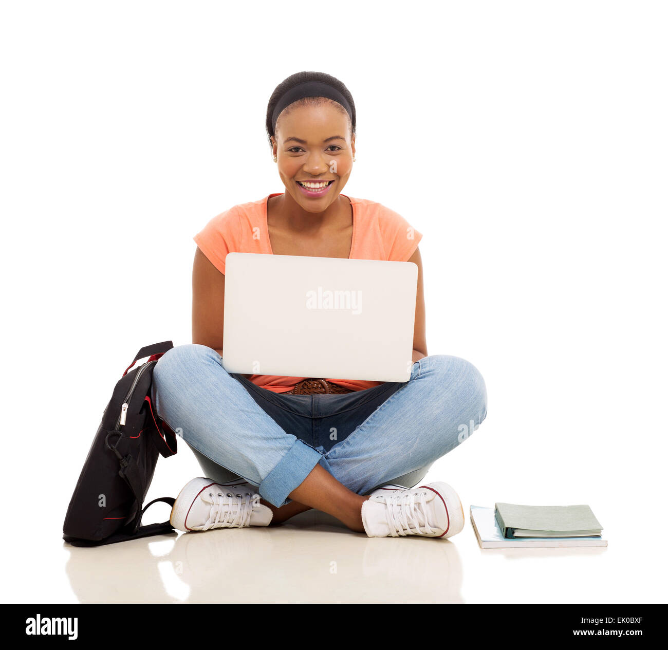 attractive female African college student using laptop isolated on ...