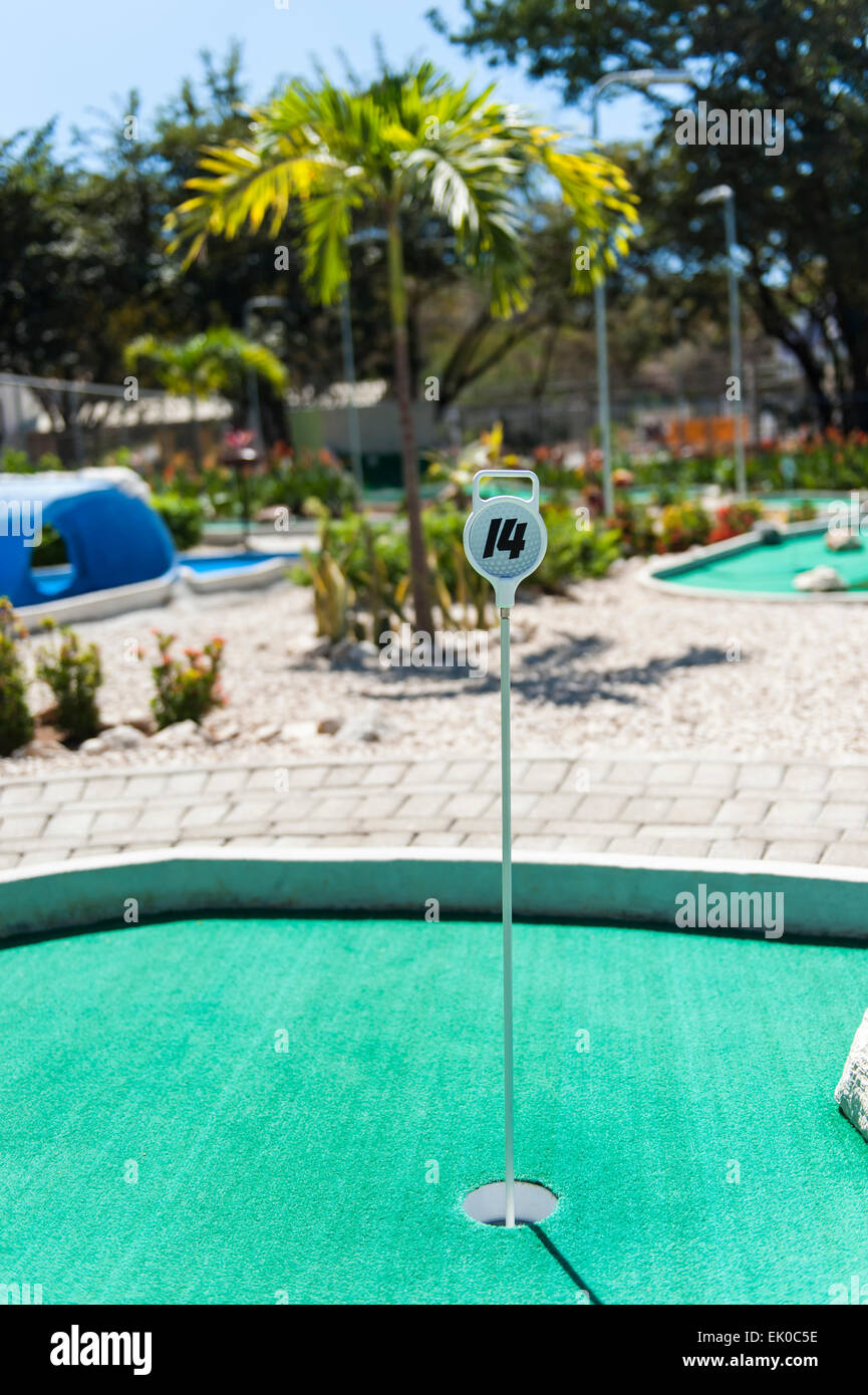 Hole 14 on a tropical outdoor mini golf course Stock Photo - Alamy