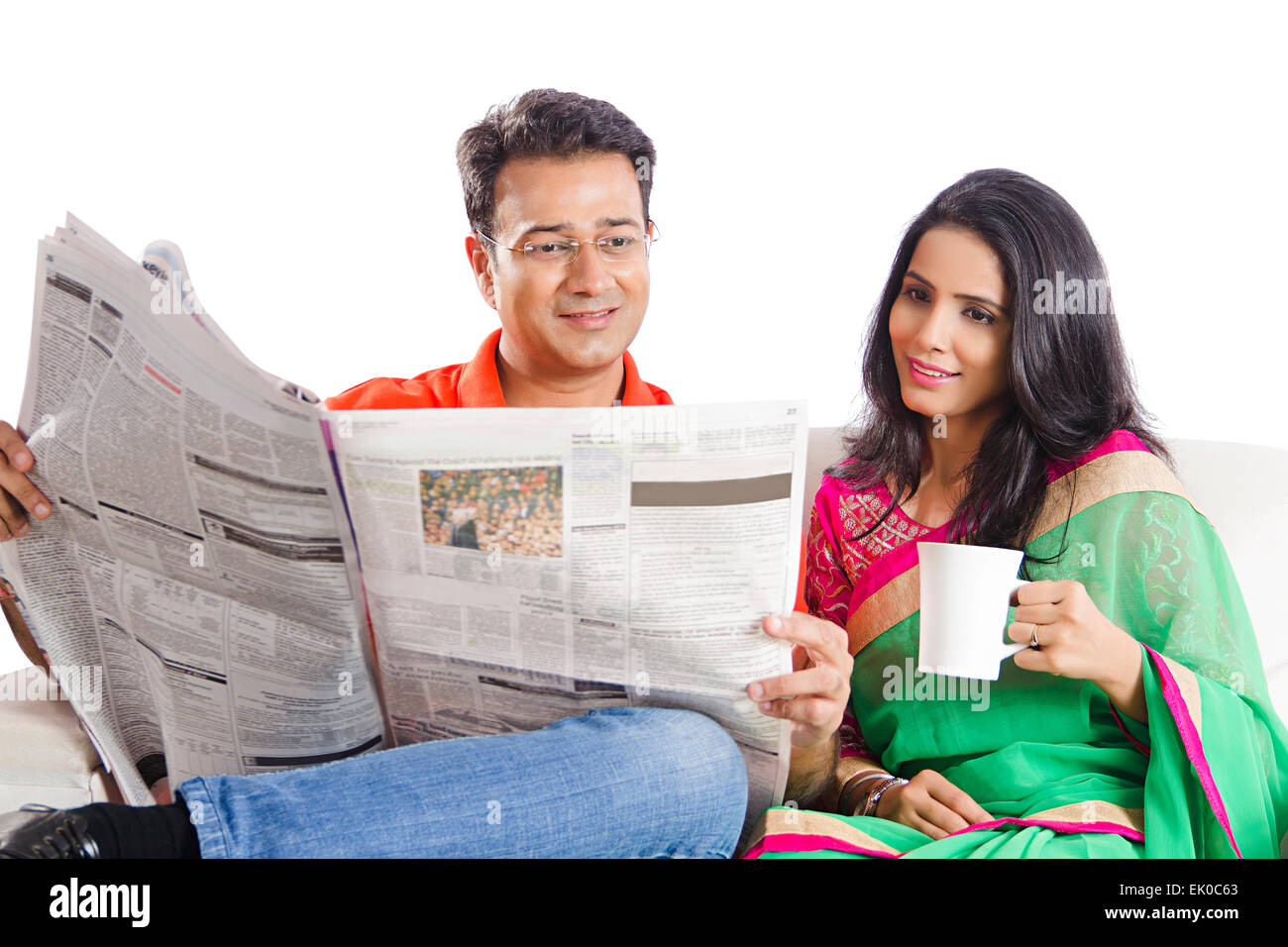 2 indian Married couples home Newspaper reading Stock Photo - Alamy