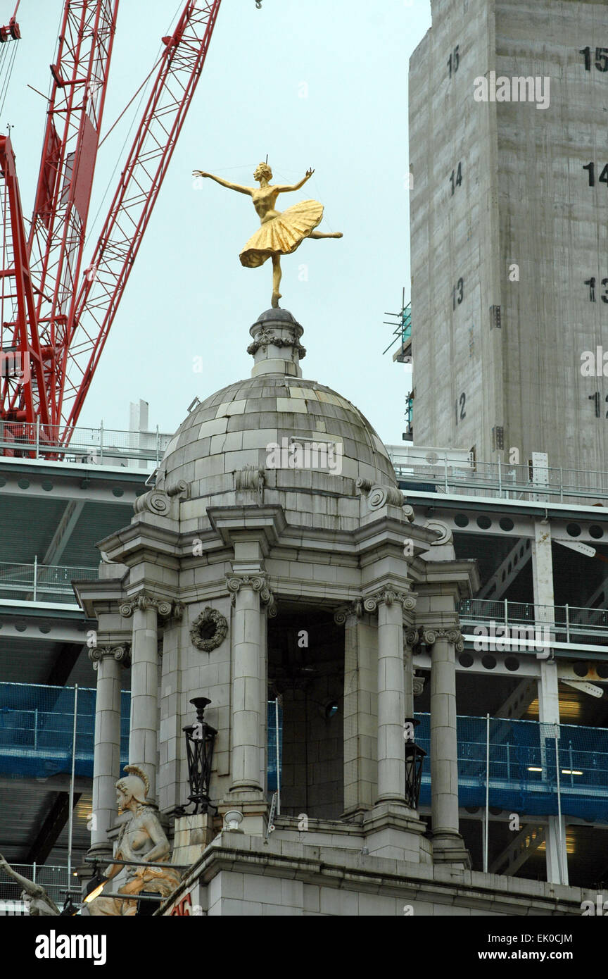 London, UK, 03 April 2015, the gilded statue of ballerina Anna Pavlova above the cupola of the ...