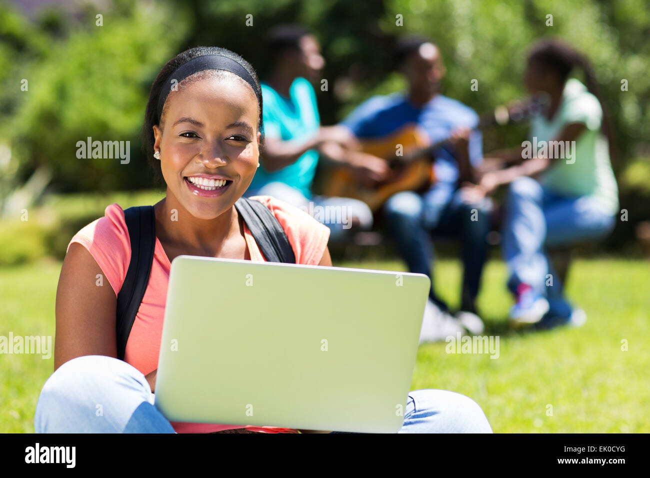 cheerful African college student using laptop outdoors Stock Photo - Alamy