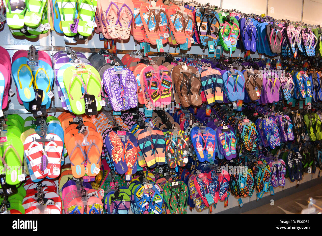 Variety of colorful flip flops as shown on display inside a shopping ...