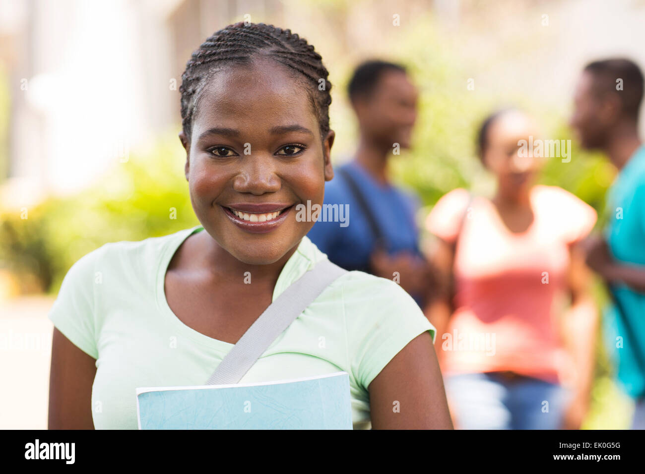 happy university student looking at the camera Stock Photo - Alamy