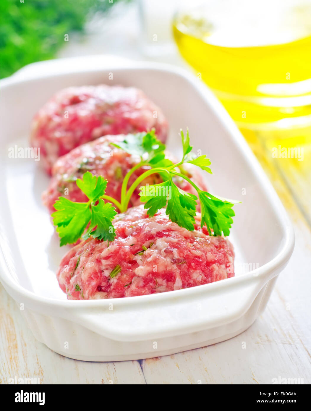 Raw meat balls in the white bowl Stock Photo - Alamy