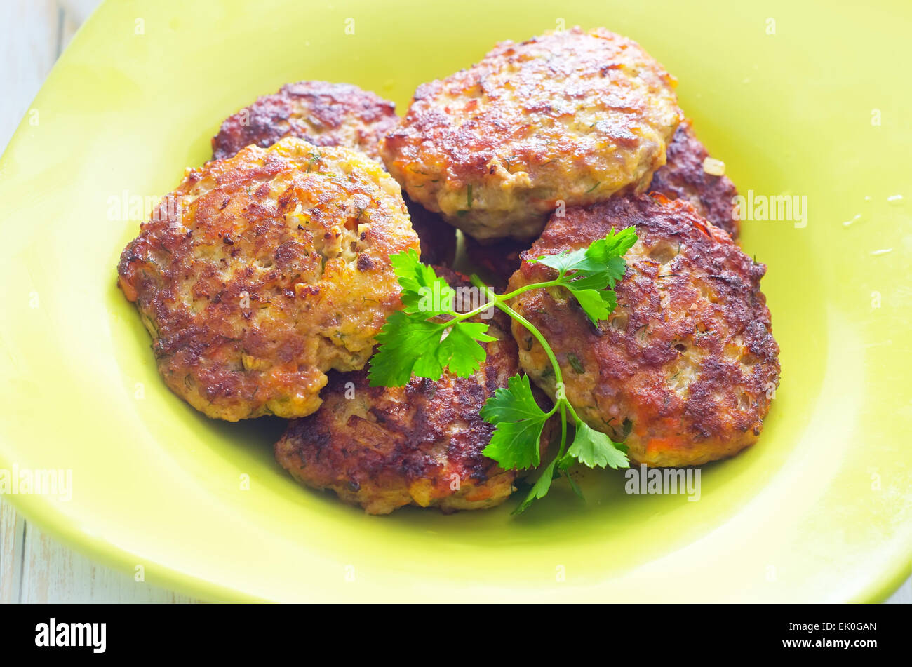 cutlets on the green plate Stock Photo - Alamy