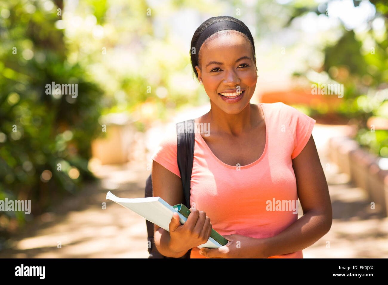 pretty female African college student going to class Stock Photo - Alamy