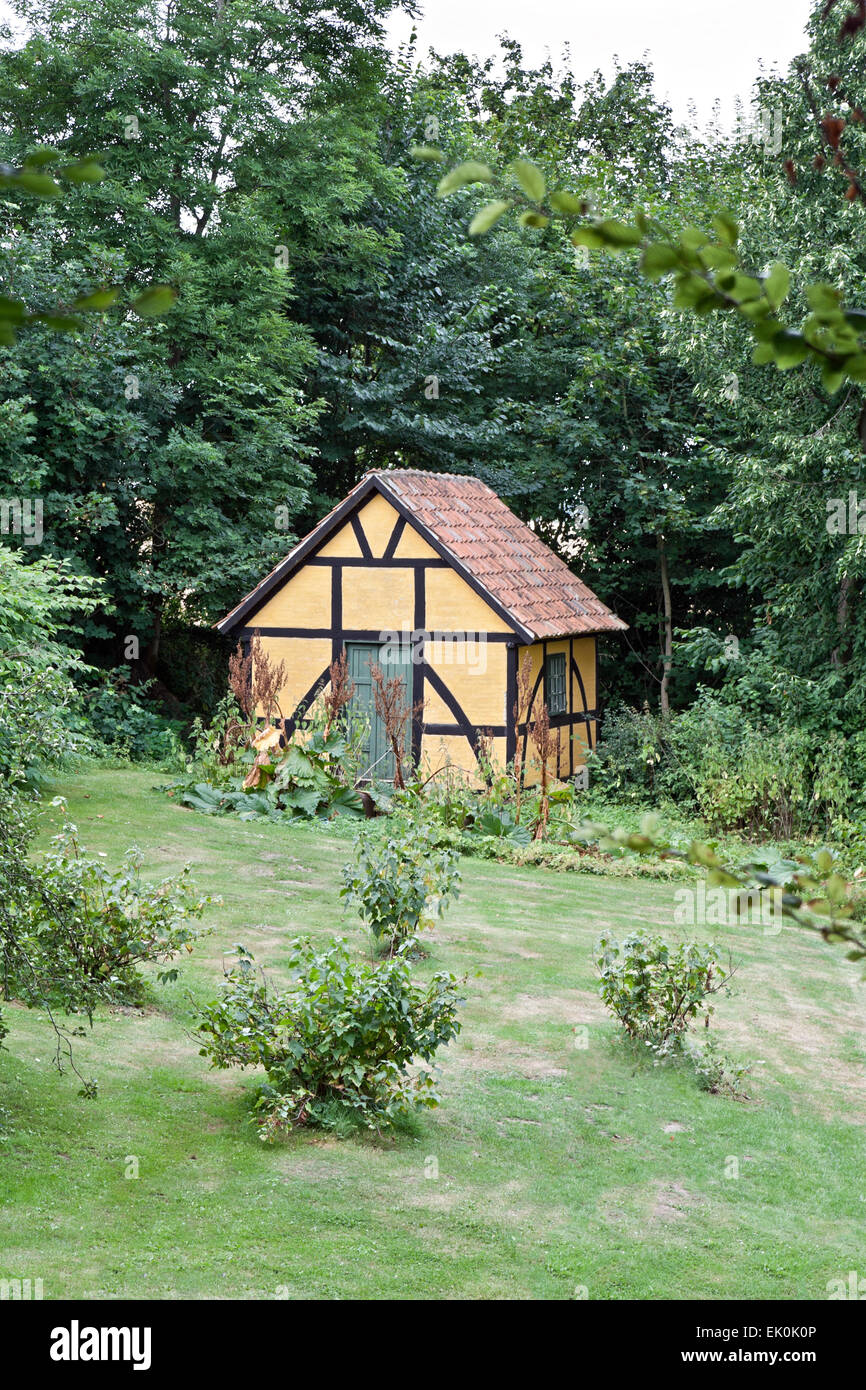 Yellow half-timbered cottage in a forest near Svendborg, Denmark Stock ...