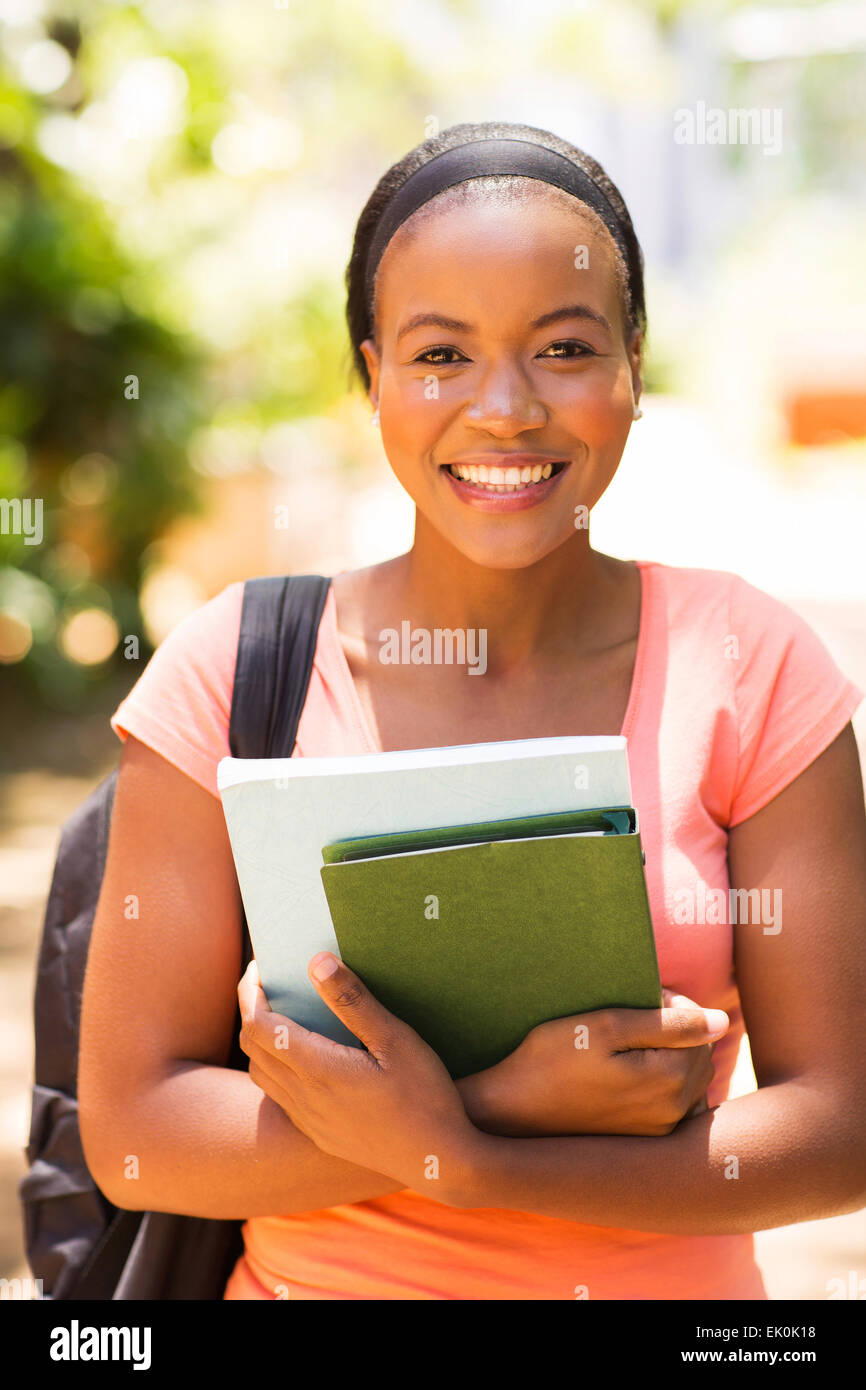 beautiful African university student holding books Stock Photo - Alamy