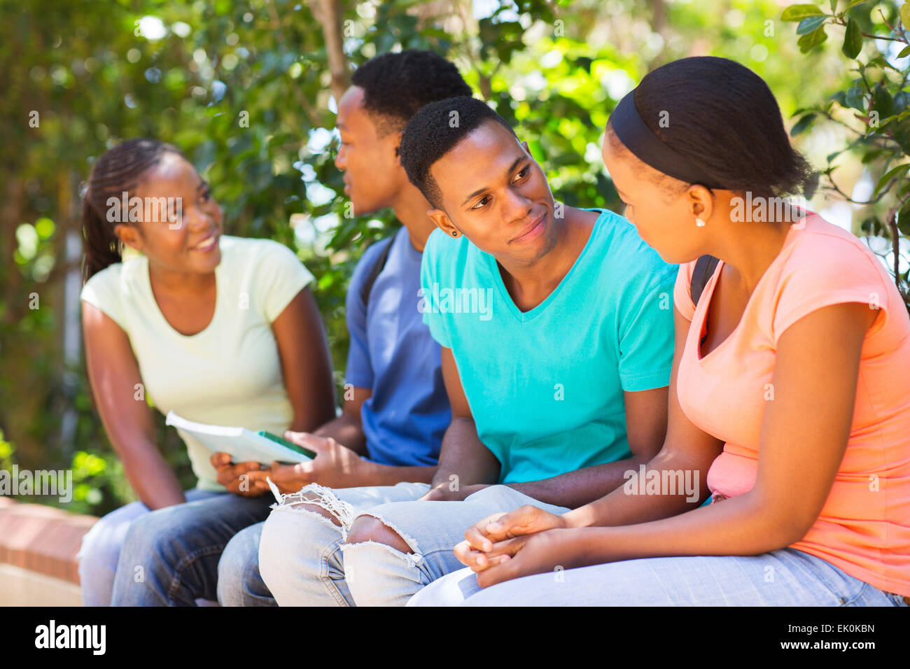 group of young college students sitting outdoors Stock Photo - Alamy