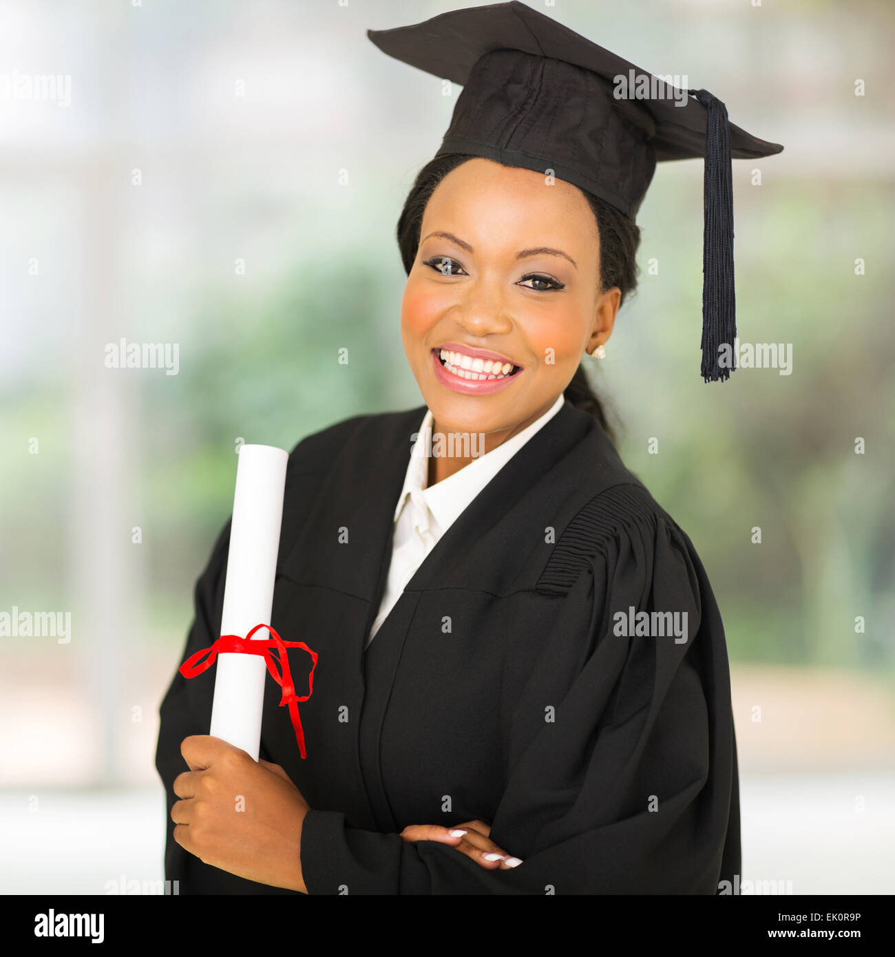 gorgeous female African university graduate looking at the camera Stock ...