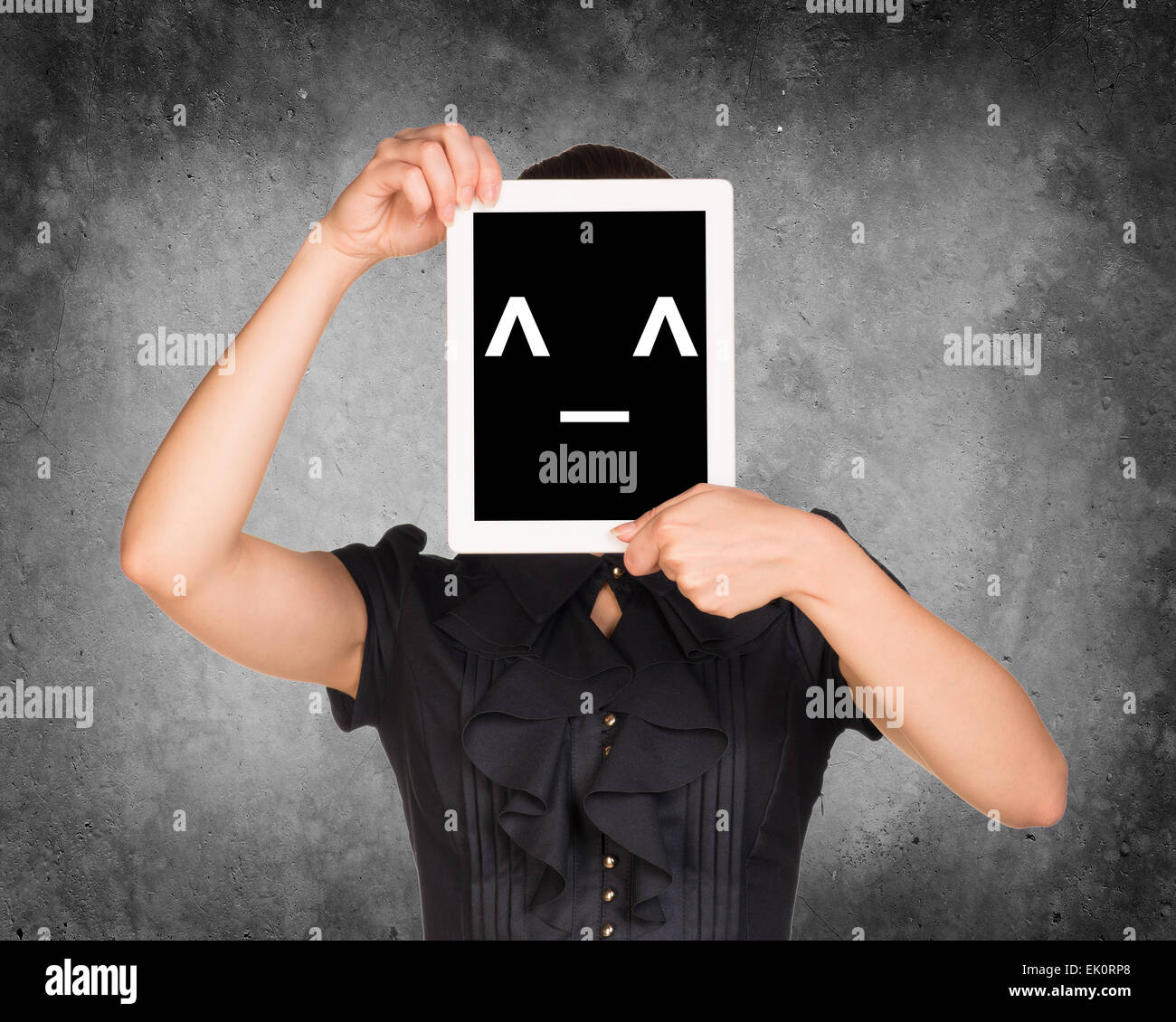 Woman in dress covered her face with tablet. On screen code smiley ...