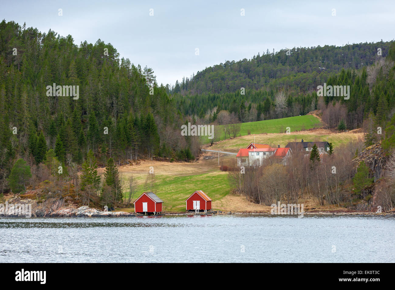 Traditional Norwegian small village, colorful wooden houses and barns ...