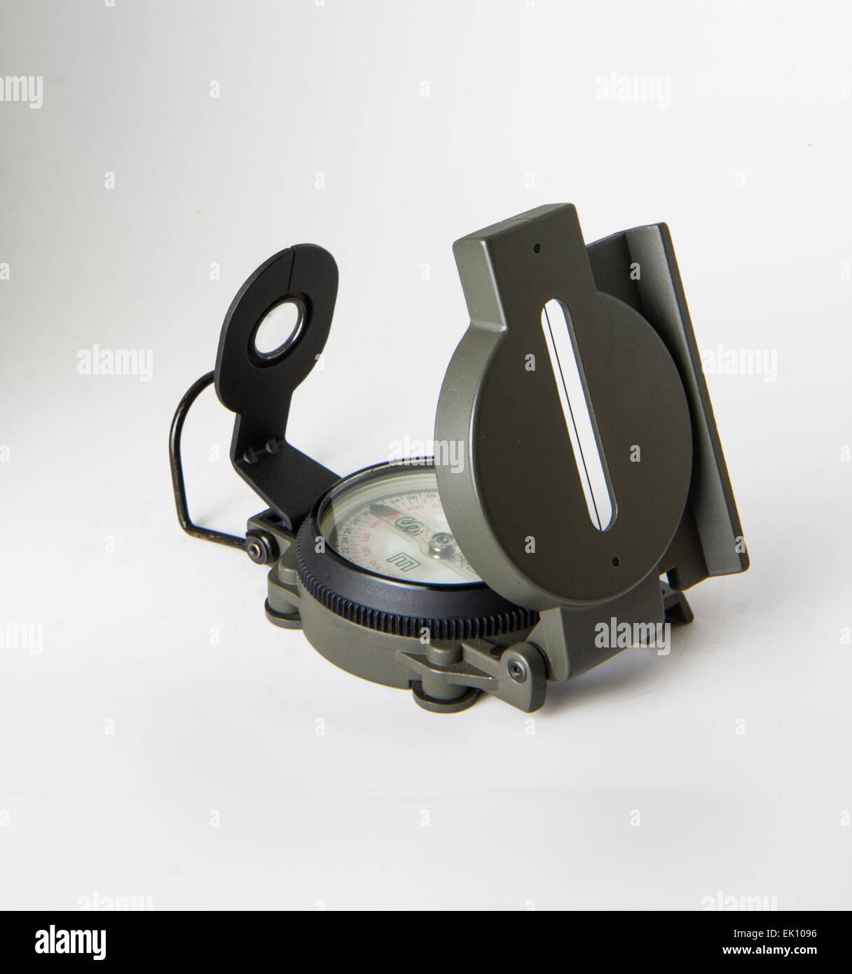 closeup of a topographics compass on white background Stock Photo - Alamy