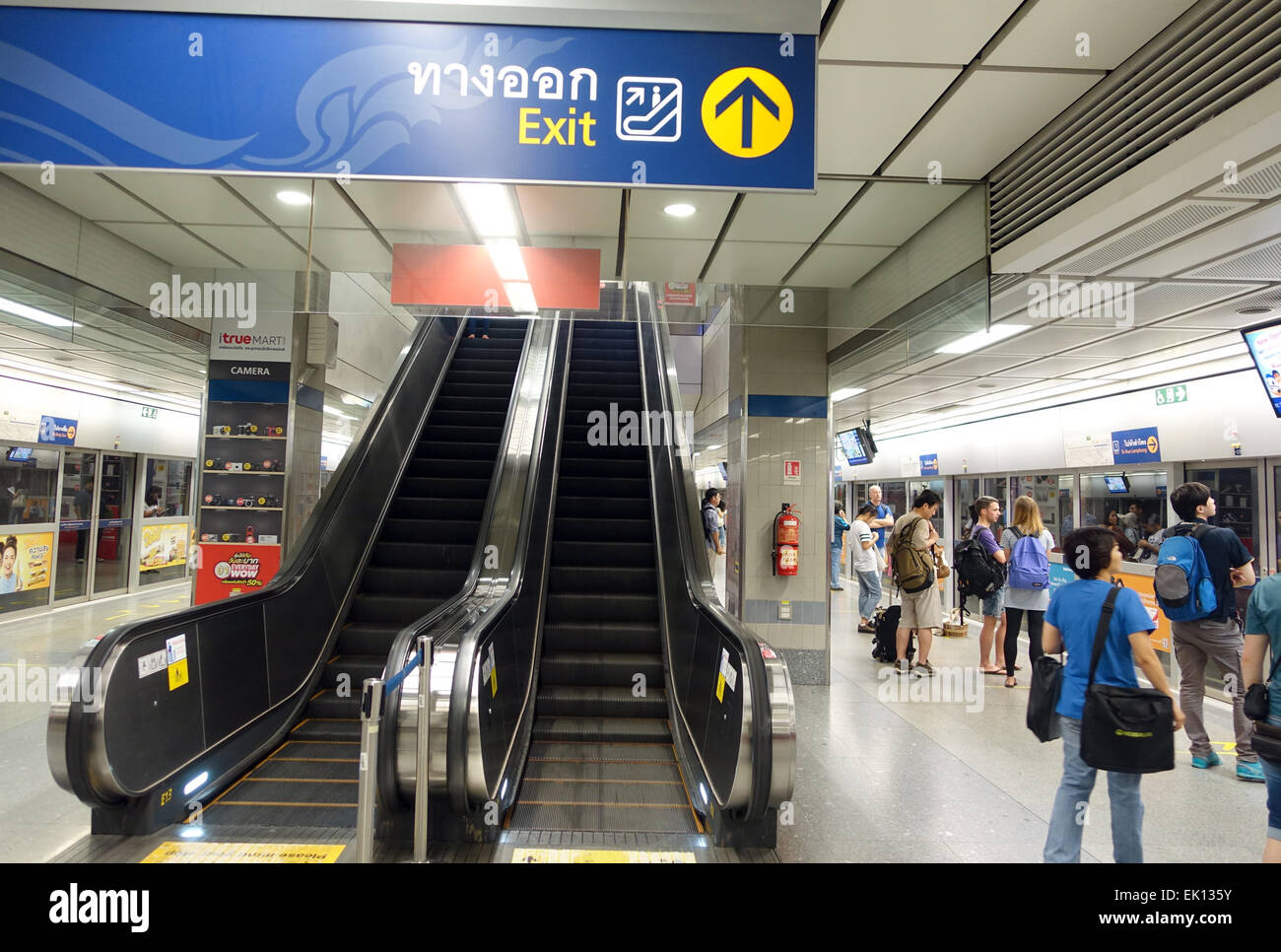 Two platforms and two escalators at the subway station Asok in Bangkok ...