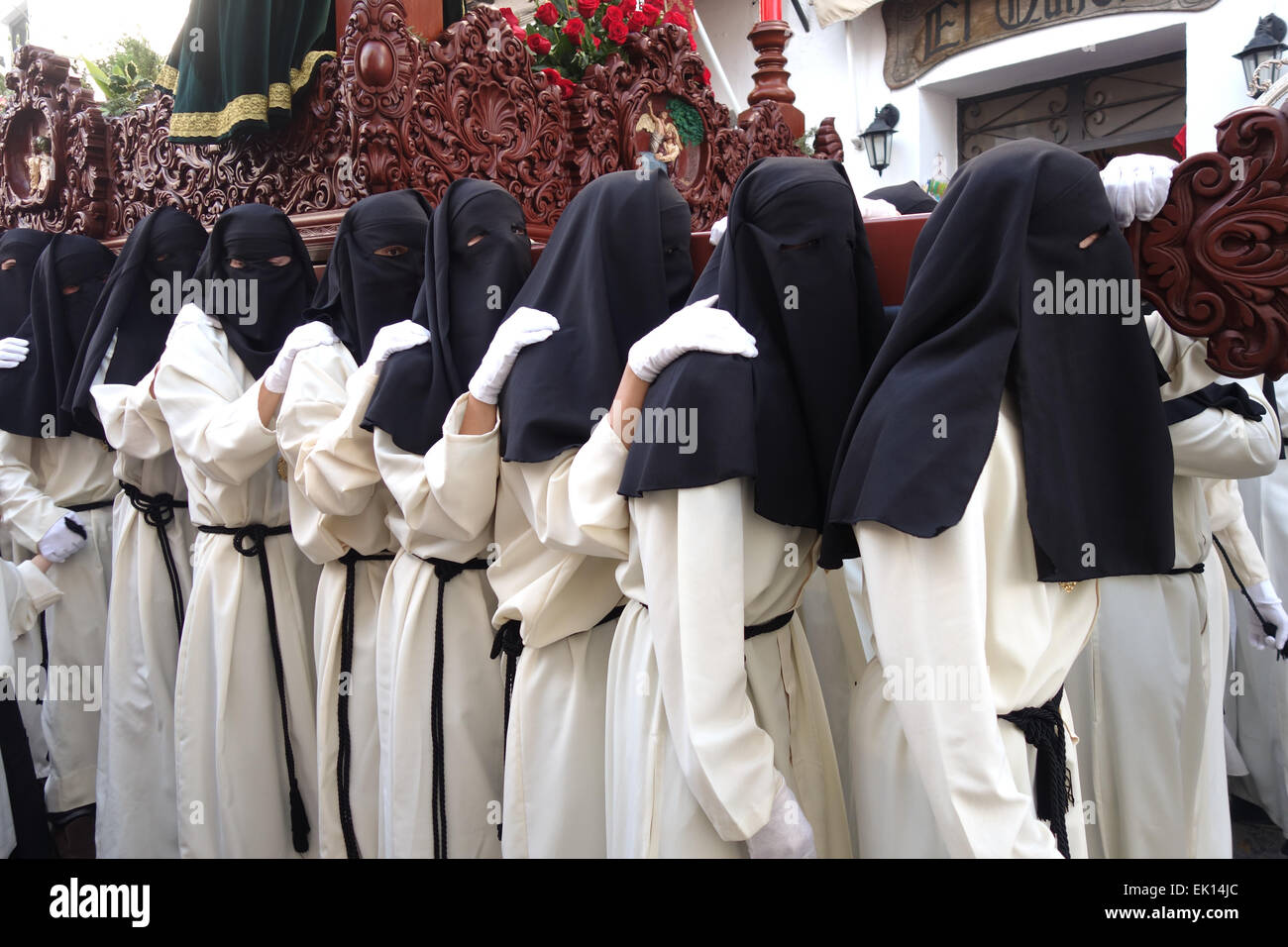 Hooded men carrying float during Procession, Holy week, semana santa ...