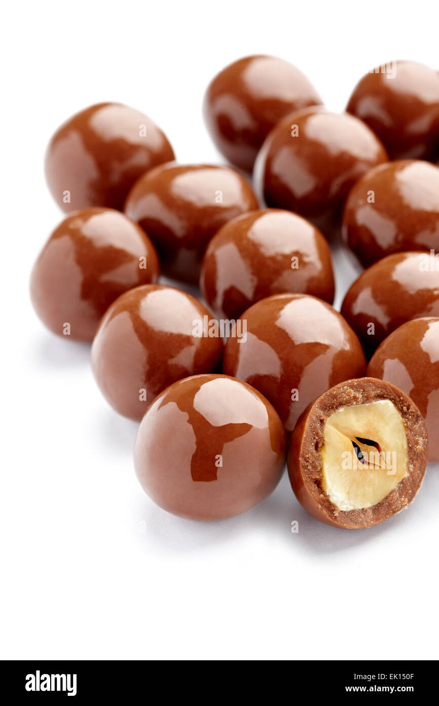 close up of chocolate candy with nuts on white background Stock Photo ...