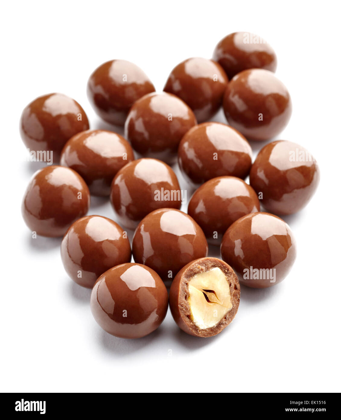 close up of chocolate candy with nuts on white background Stock Photo ...