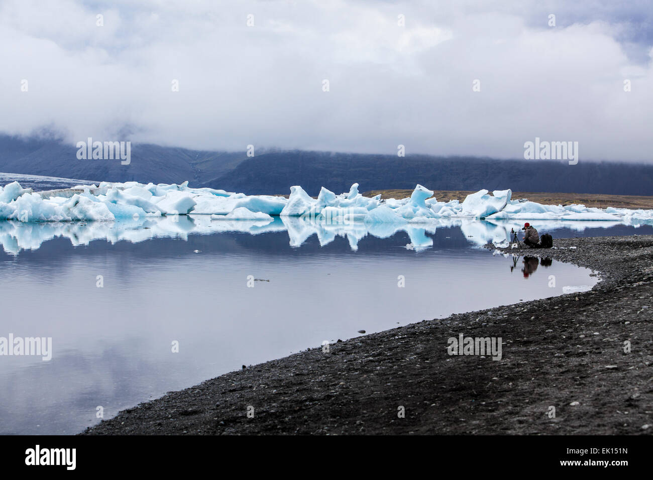 View of Jokulsarlon glacial lagoon in Iceland and photographer taking ...