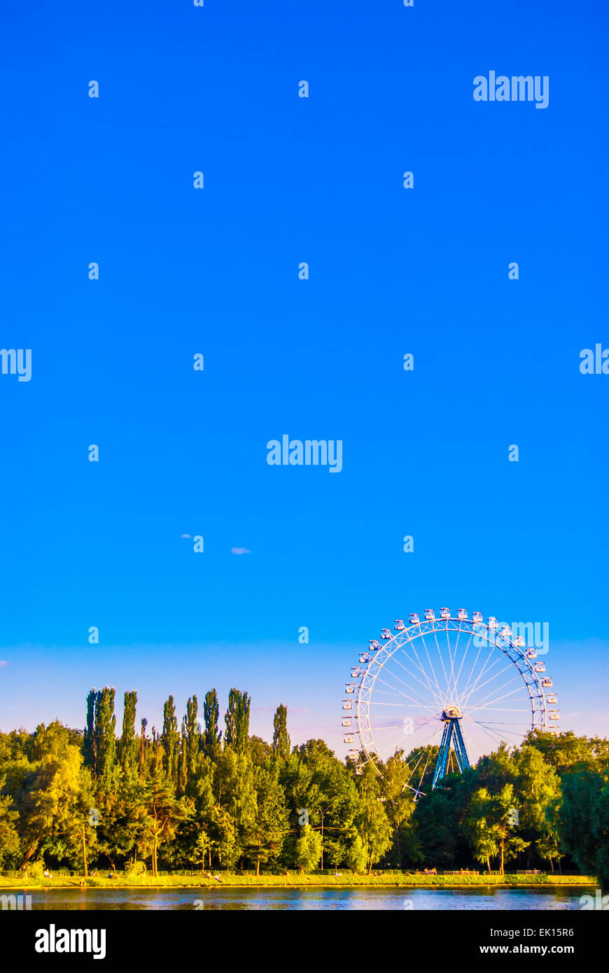 Landscape with ferris wheel Stock Photo - Alamy