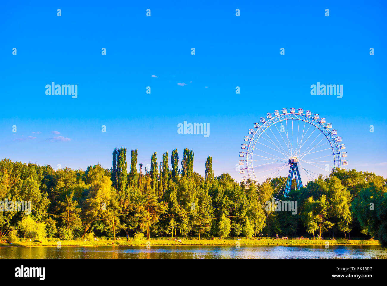 Landscape with ferris wheel Stock Photo - Alamy